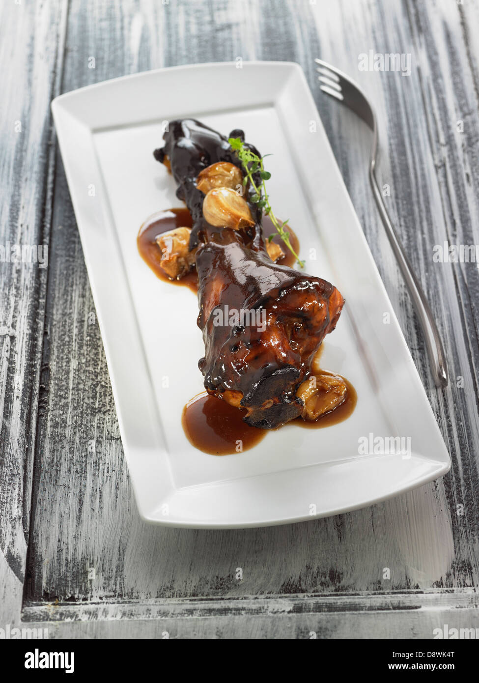 Knuckle of lamb stew with garlic and Brandy Stock Photo - Alamy