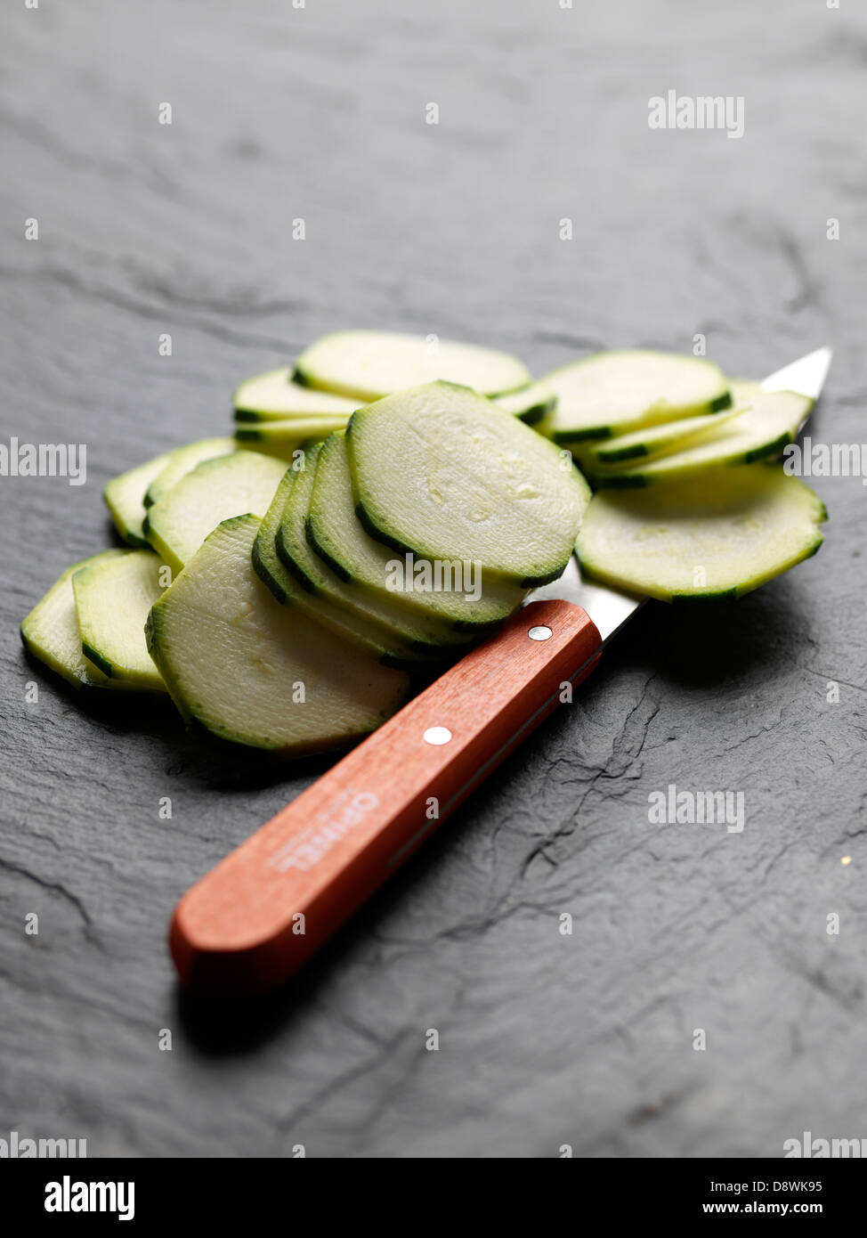 Slicing a zucchini Stock Photo - Alamy