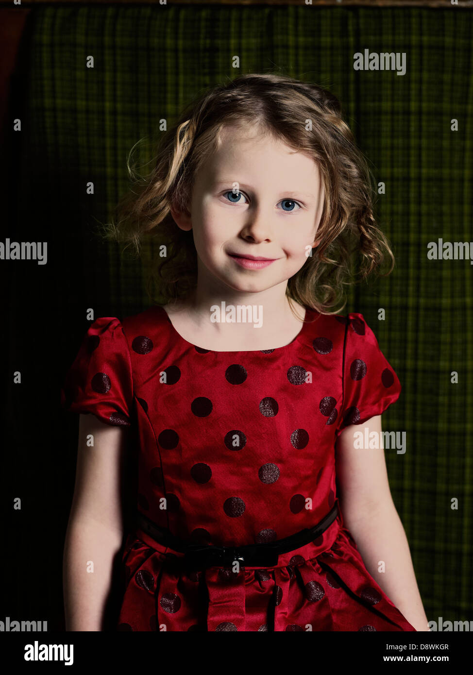 Portrait of girl wearing spotted dress Stock Photo - Alamy