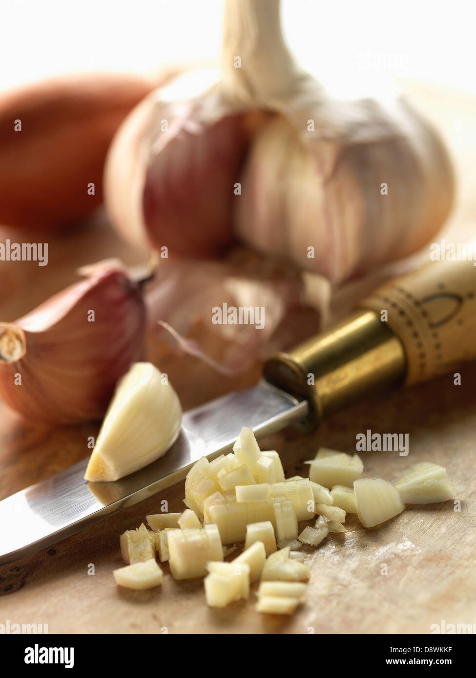 Finely chopping the garlic Stock Photo - Alamy