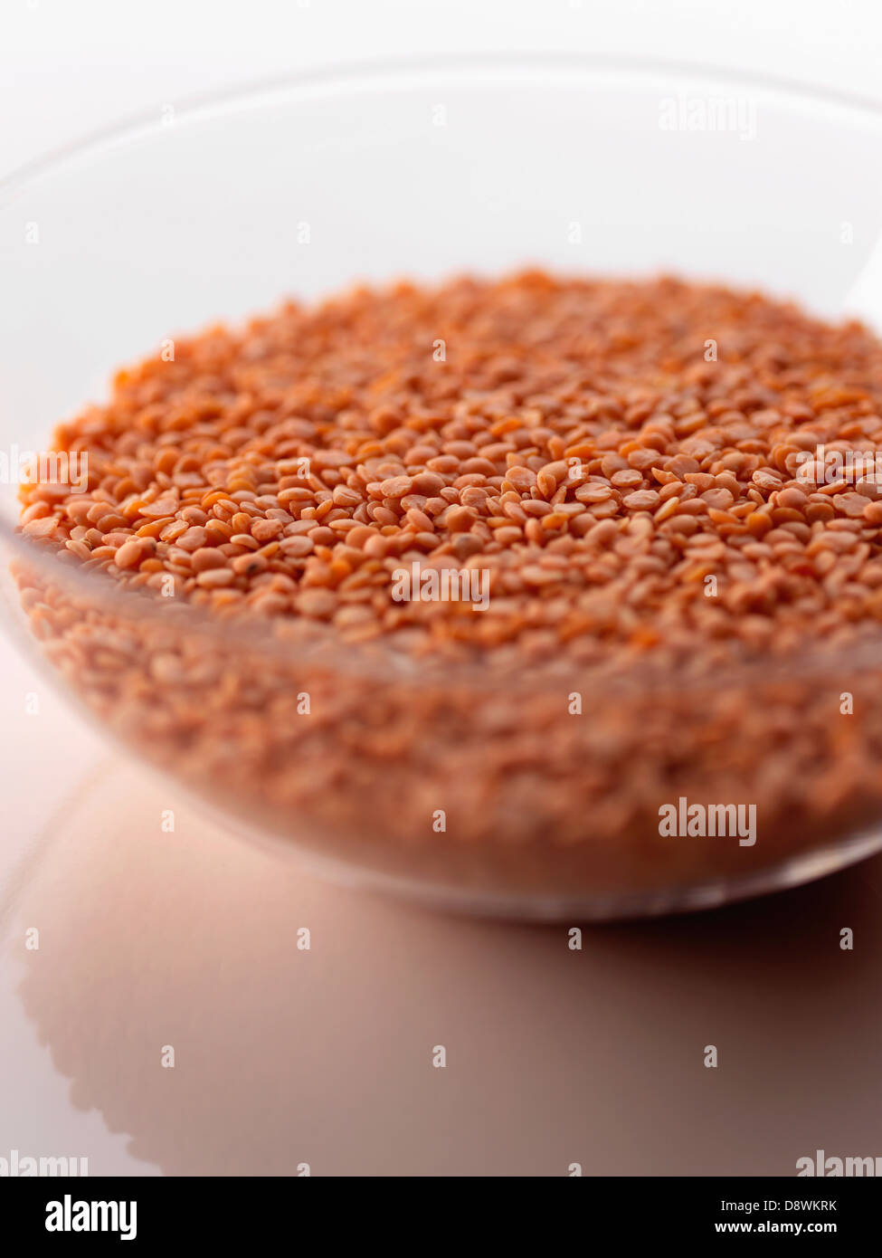 Bowl of uncooked orange lentils Stock Photo - Alamy