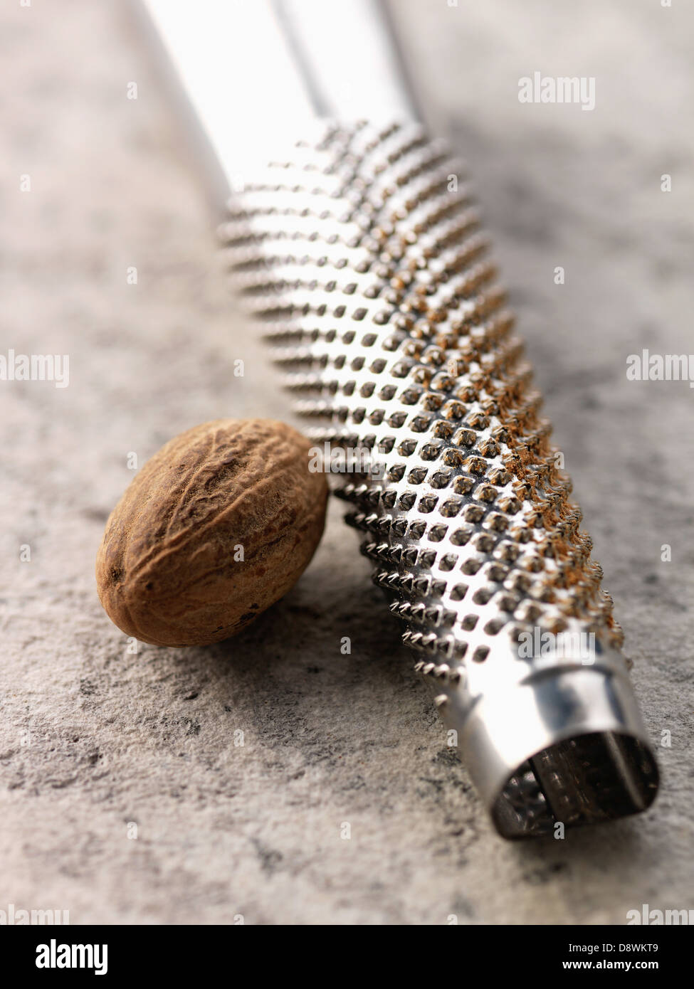 Nutmeg and grater Stock Photo - Alamy