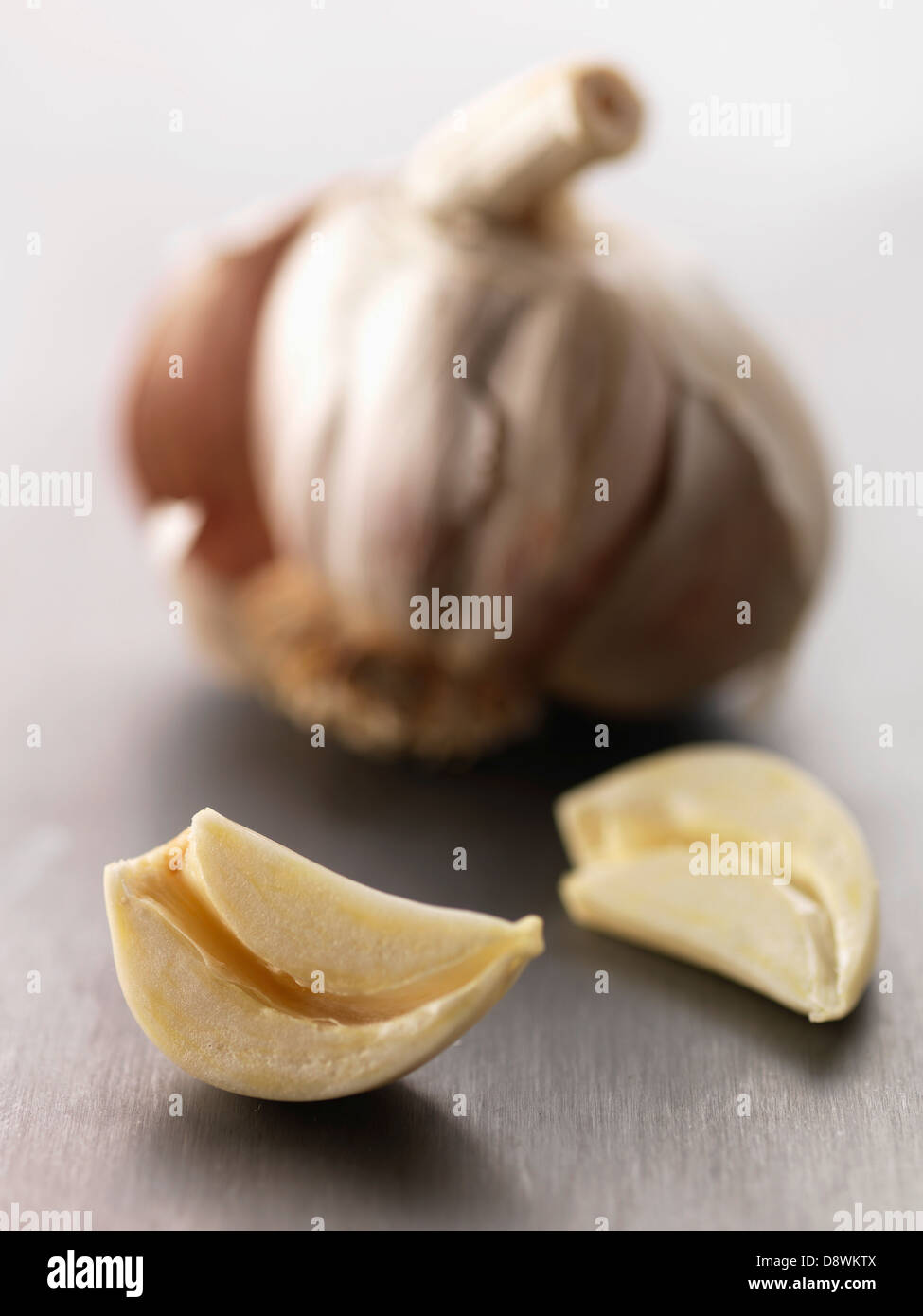 Taking the bitter center out of a clove of garlic Stock Photo - Alamy