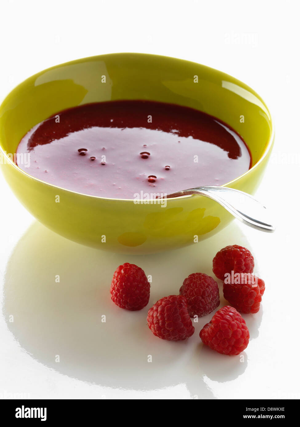 Bowl of raspberry puree Stock Photo - Alamy