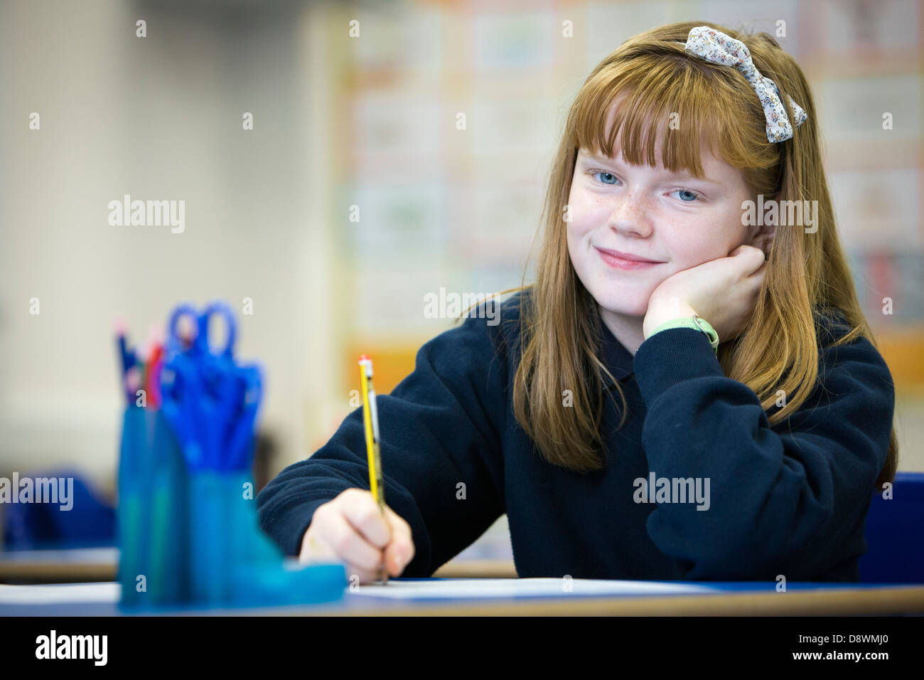 Young girl in classroom Stock Photo - Alamy