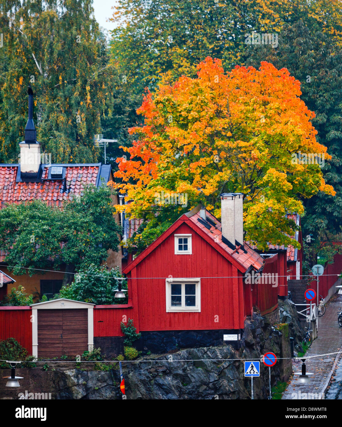 Cottage with autumn trees Stock Photo - Alamy