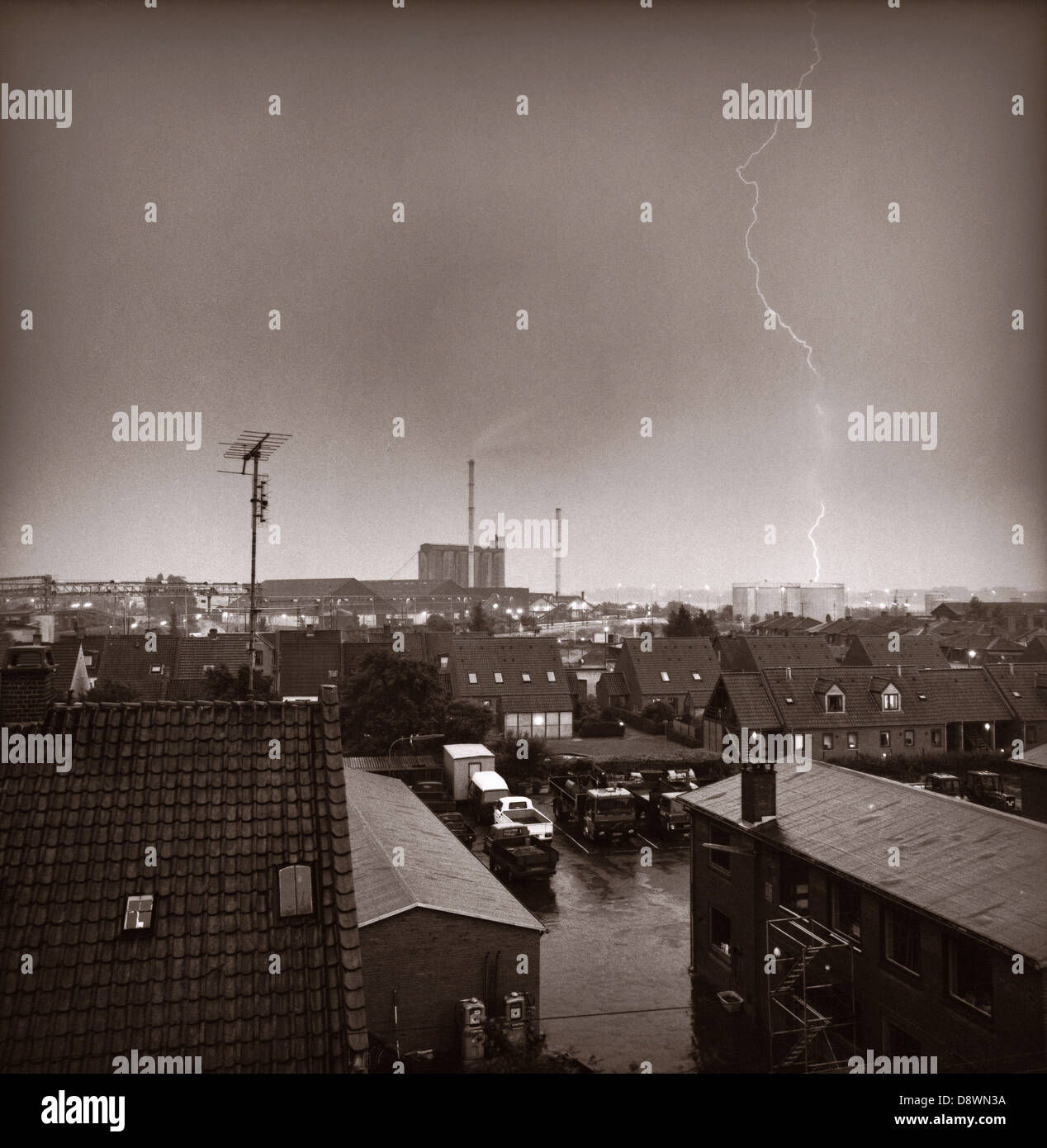 Lightning on dark sky over town Stock Photo - Alamy