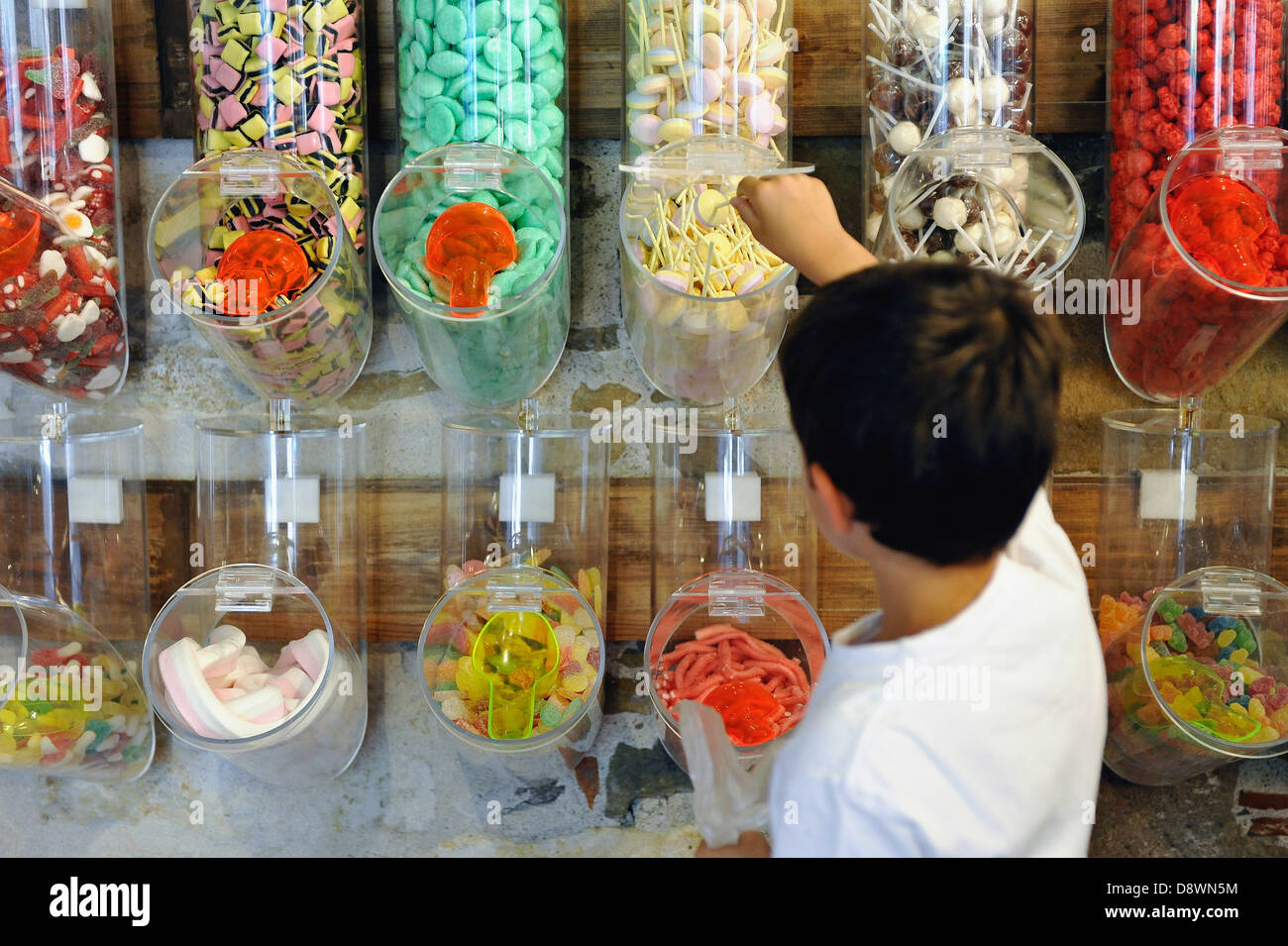 Young boy in a candy store Stock Photo - Alamy