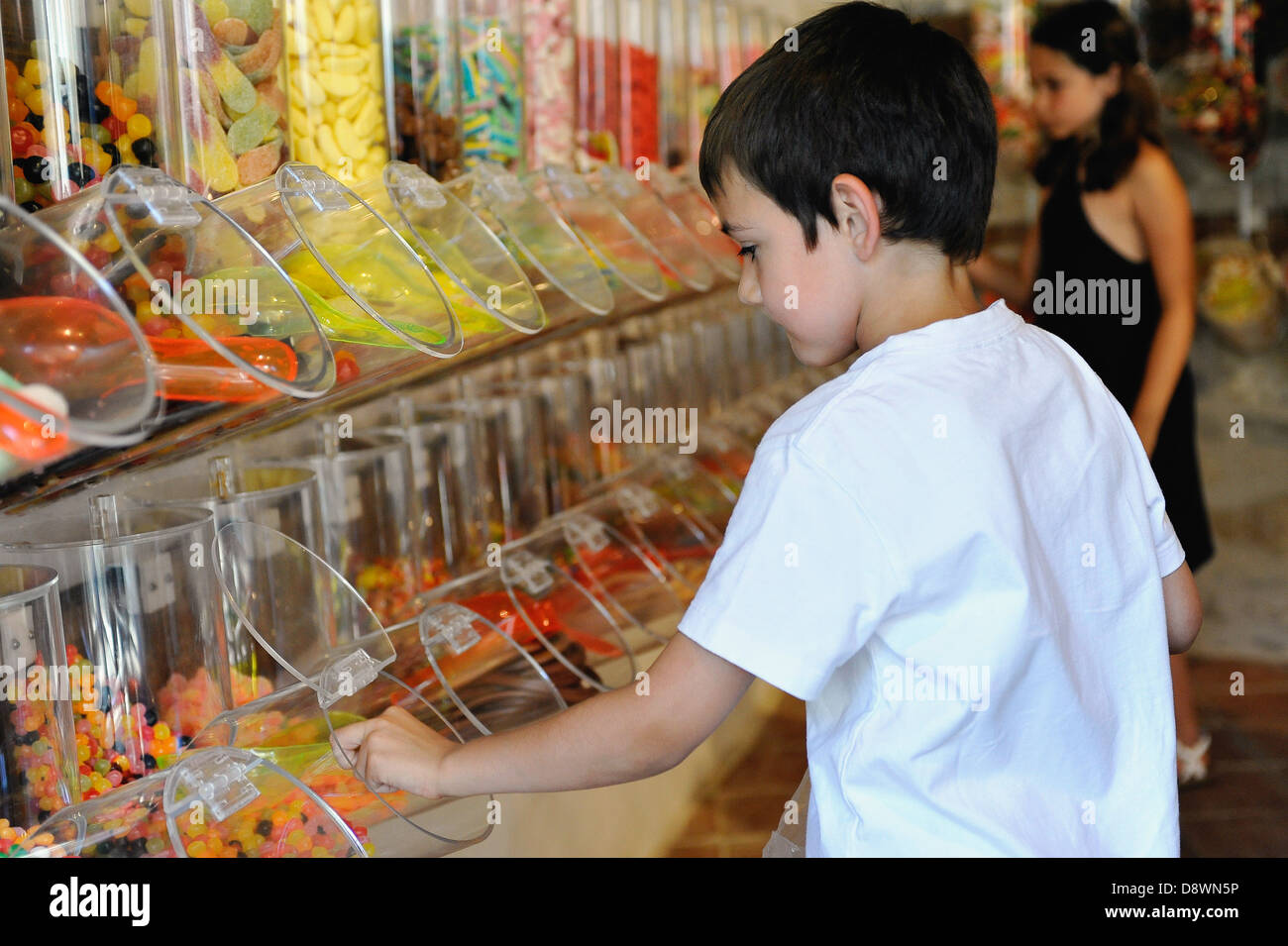 Young boy in a candy store Stock Photo - Alamy