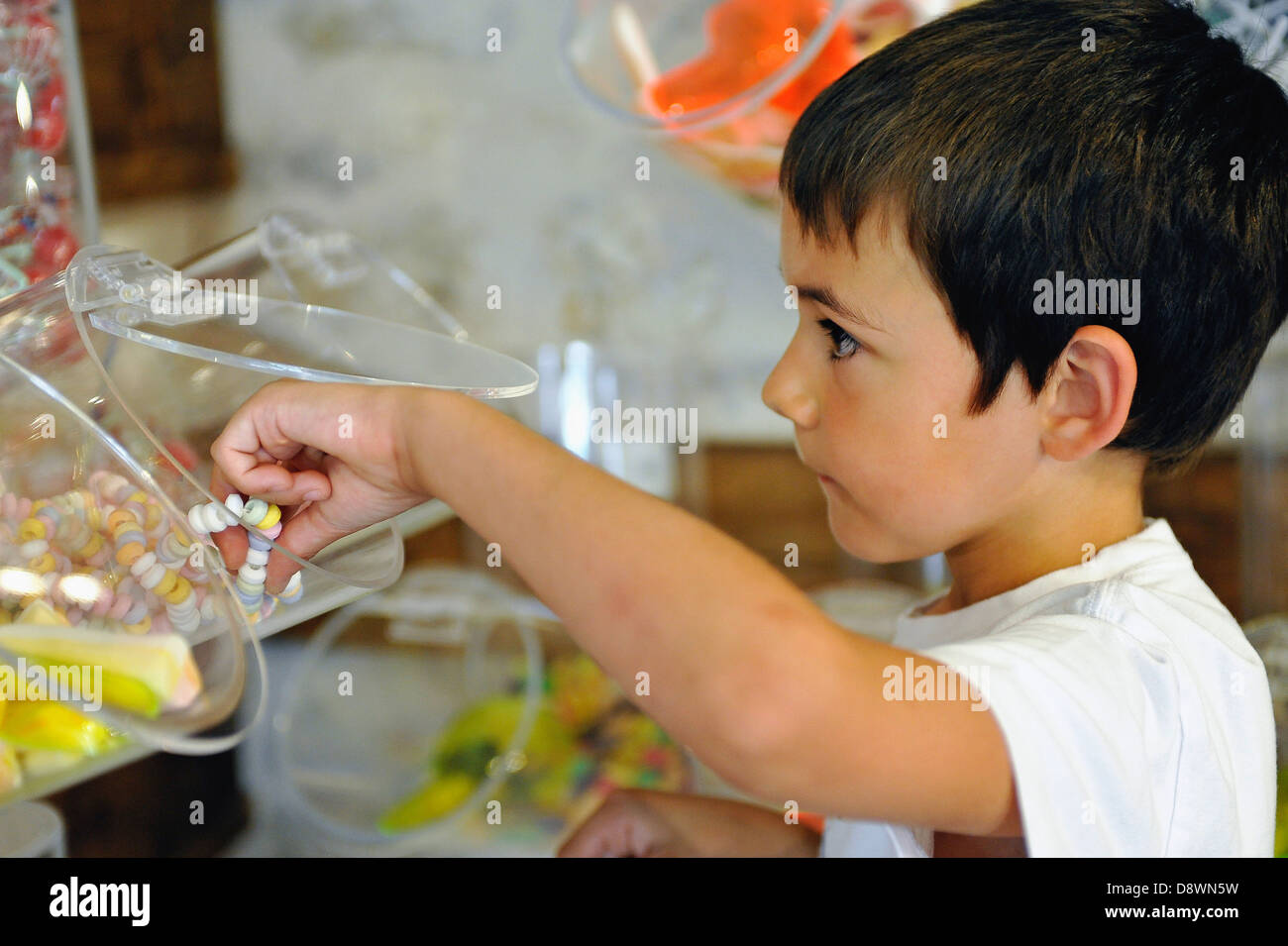 Young boy in a candy store Stock Photo - Alamy