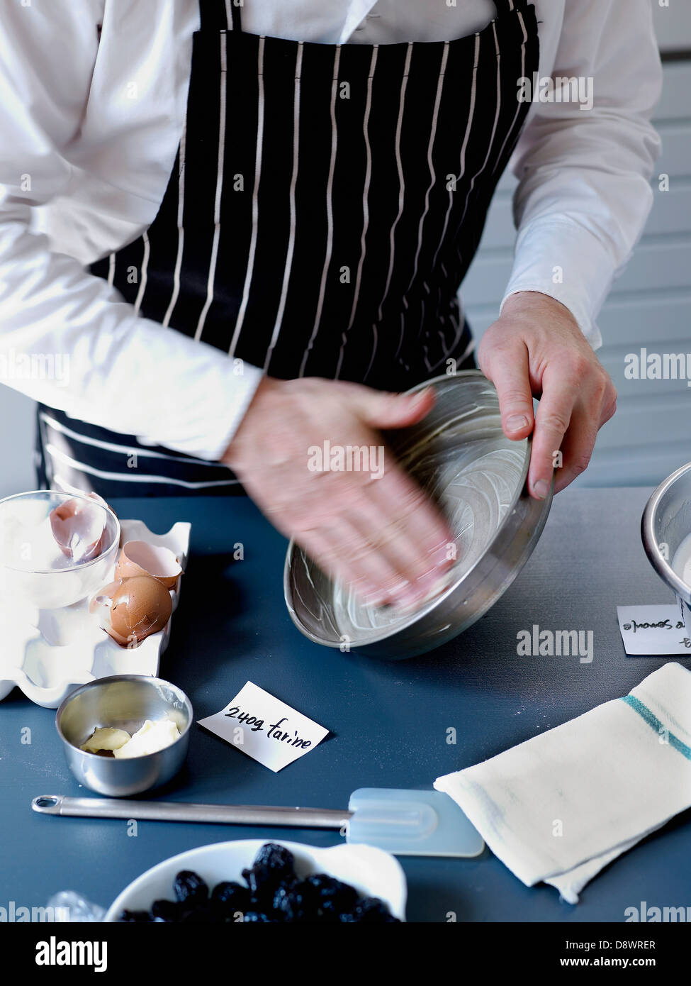 Buttering the baking tin Stock Photo - Alamy