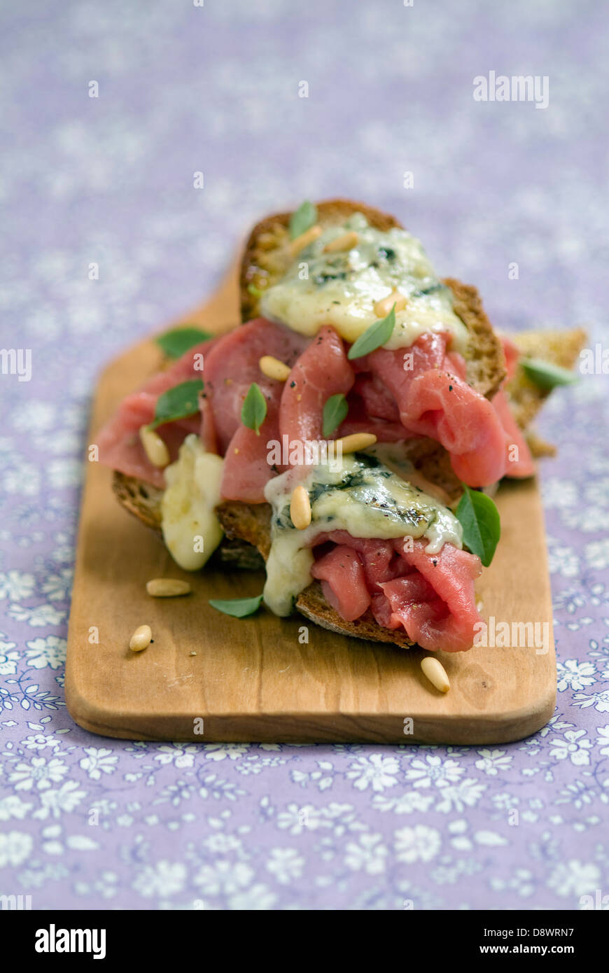 Beef and blue cheese toasted open sandwiches Stock Photo - Alamy