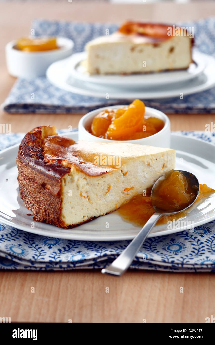 Cheesecake with stewed apricots Stock Photo - Alamy