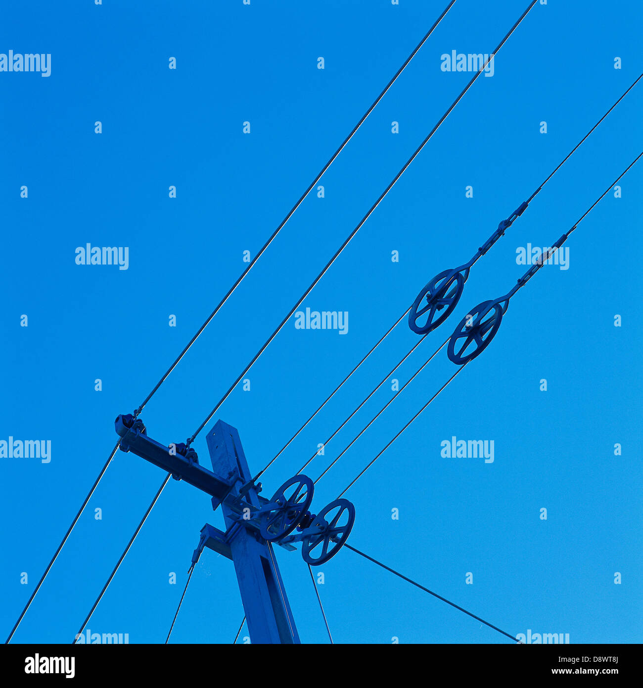 Train wire against blue sky Stock Photo - Alamy