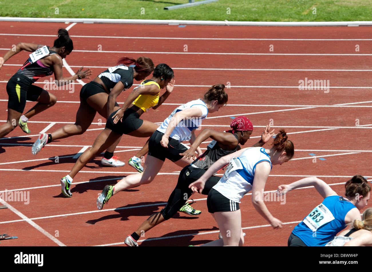 Athletics, teenage girls 100m race Stock Photo - Alamy