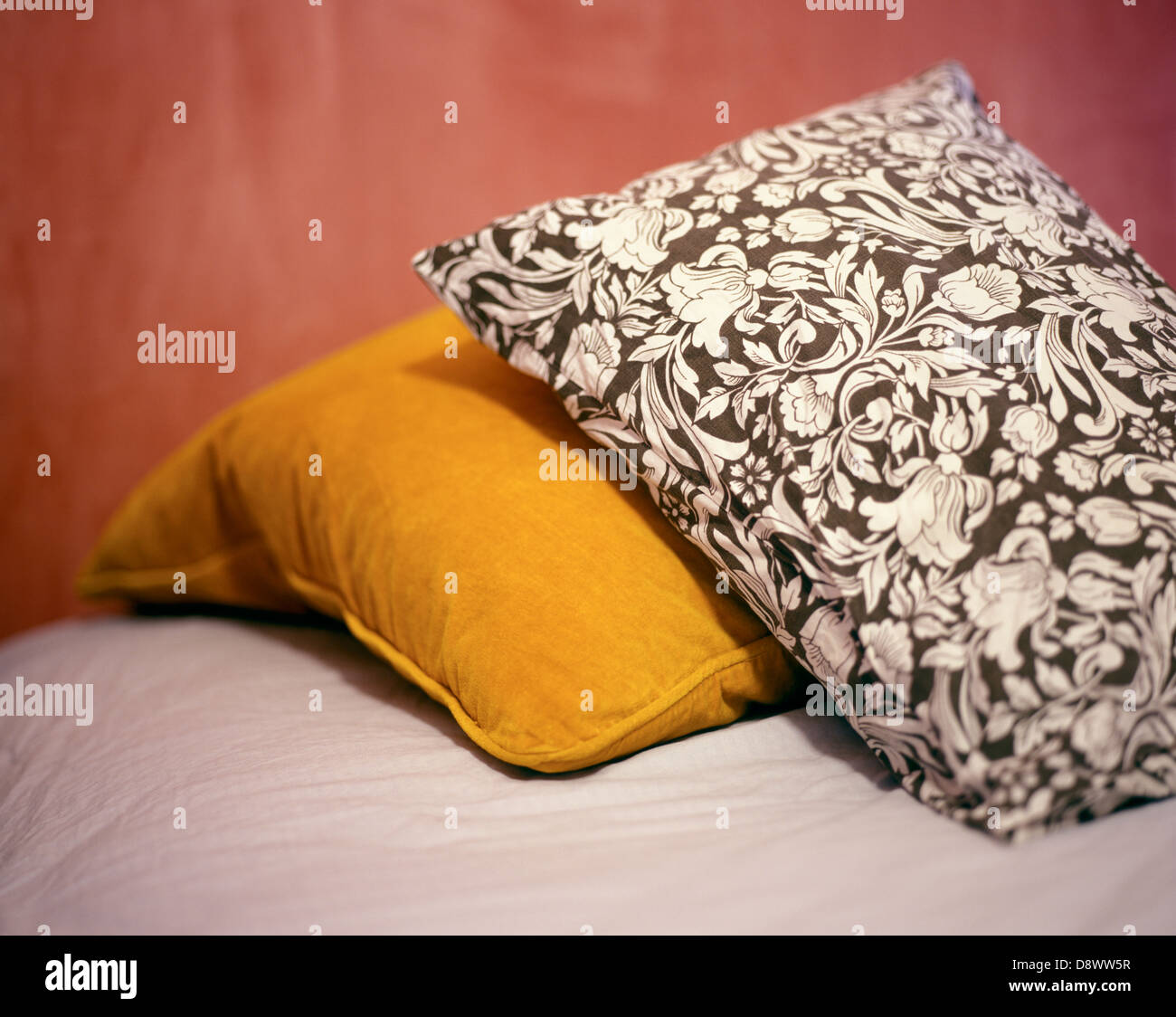Two cushions on a bed Stock Photo - Alamy