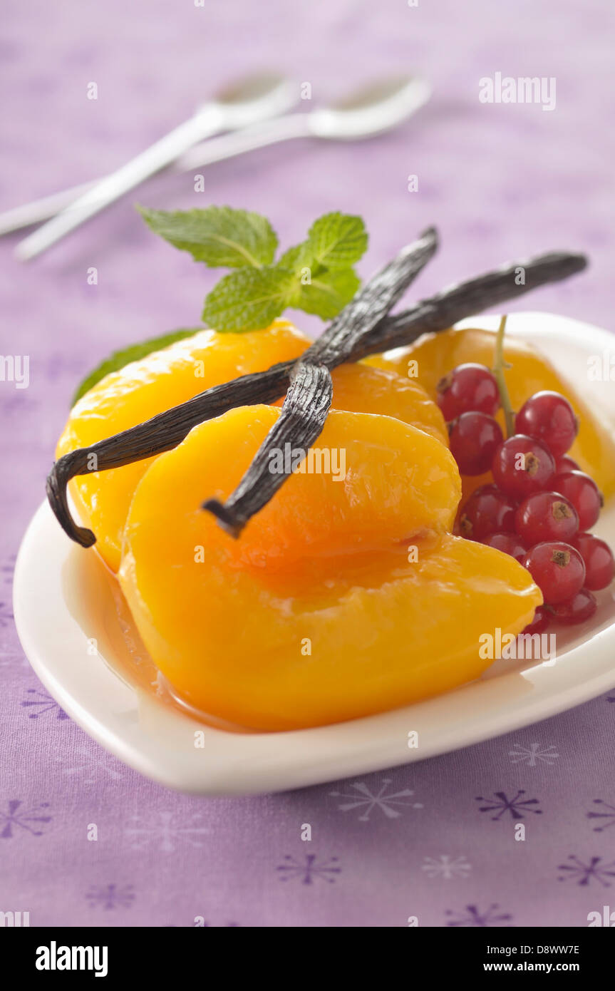 Stewed peaches with vanilla and fresh mint Stock Photo - Alamy