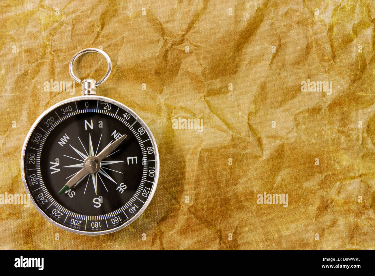 Black compass on the grunge paper background Stock Photo - Alamy