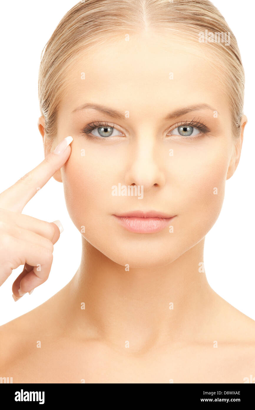 woman pointing at her eye area Stock Photo - Alamy