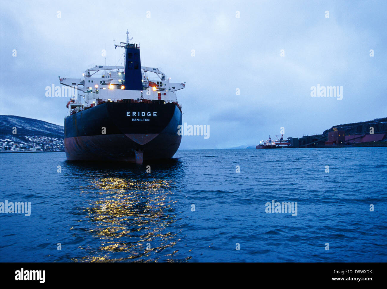 Lit cargo ships Stock Photo - Alamy