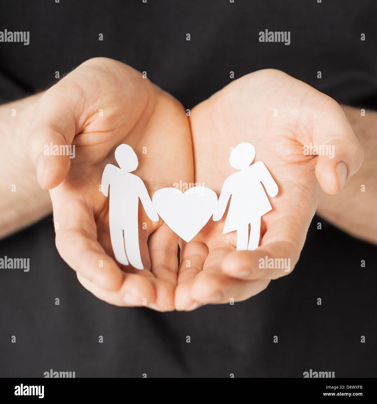 man hands with paper men Stock Photo - Alamy
