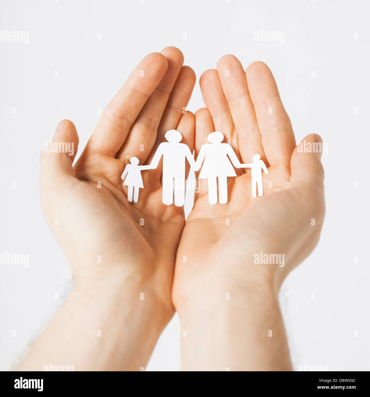 man hands with paper men Stock Photo - Alamy