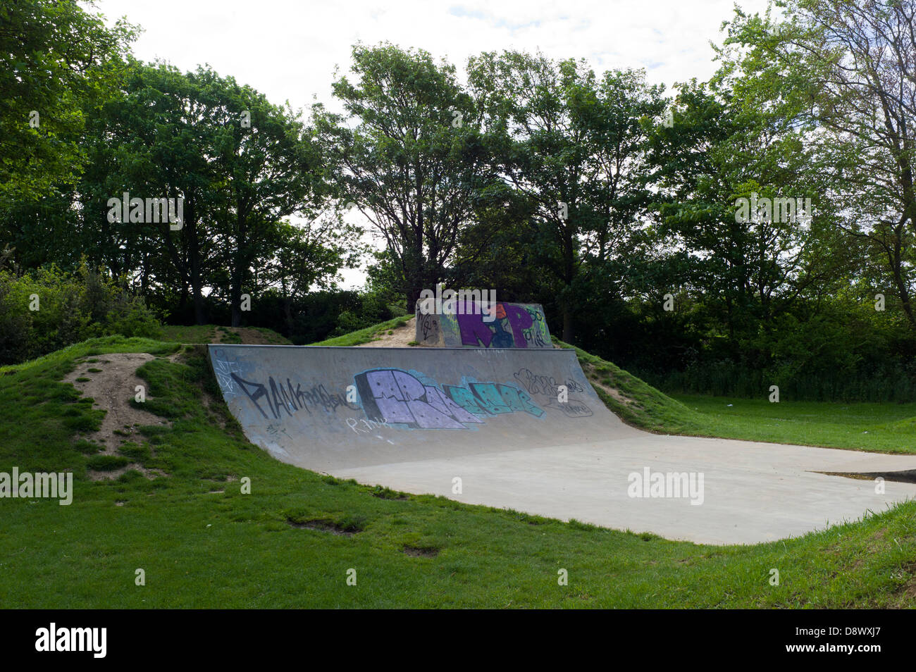 Skateboard ramp in small park Stock Photo - Alamy