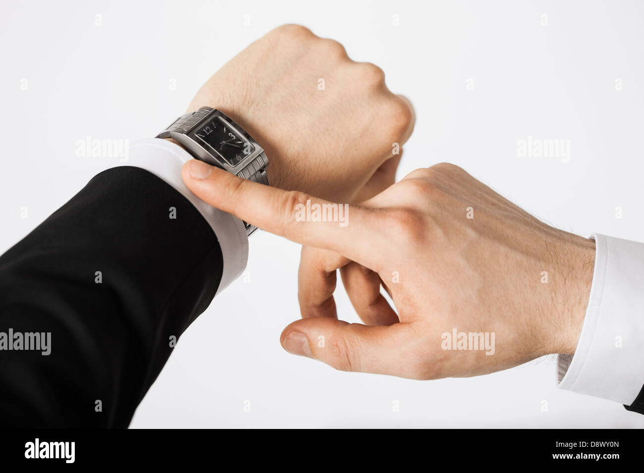 man looking at wristwatch Stock Photo - Alamy