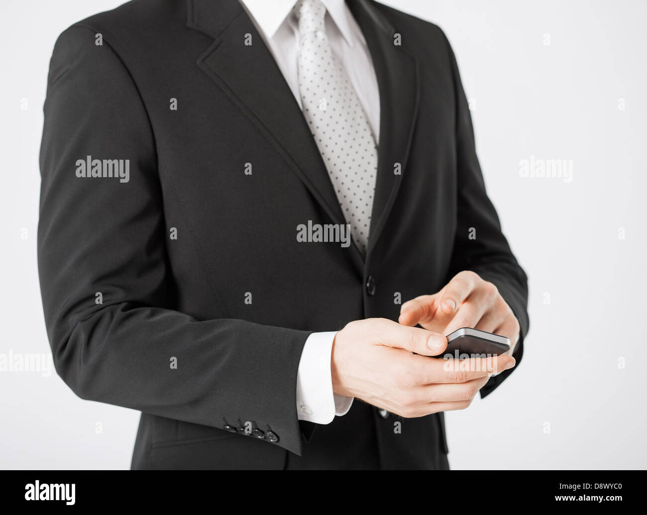 man with smartphone typing something Stock Photo - Alamy