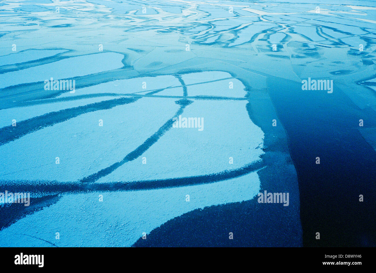 Snow on melting ice Stock Photo - Alamy