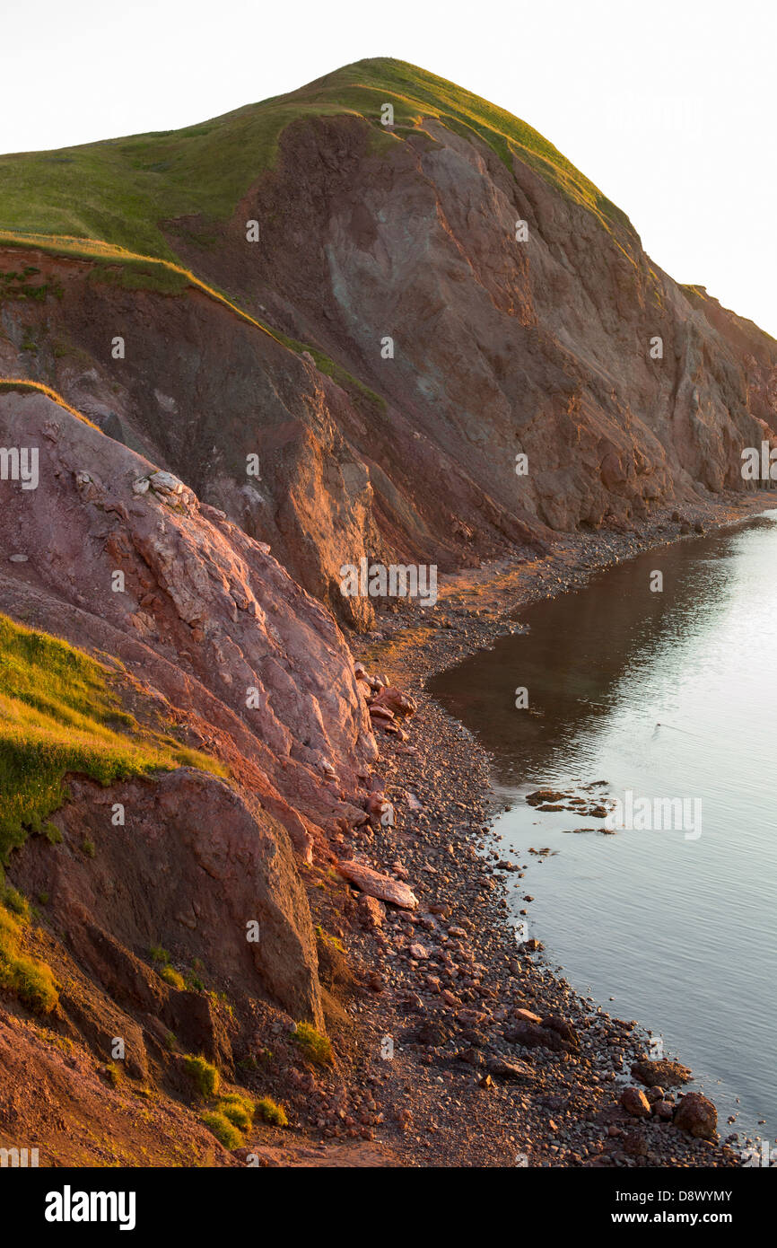 Cliff at dusk on the sea Stock Photo - Alamy