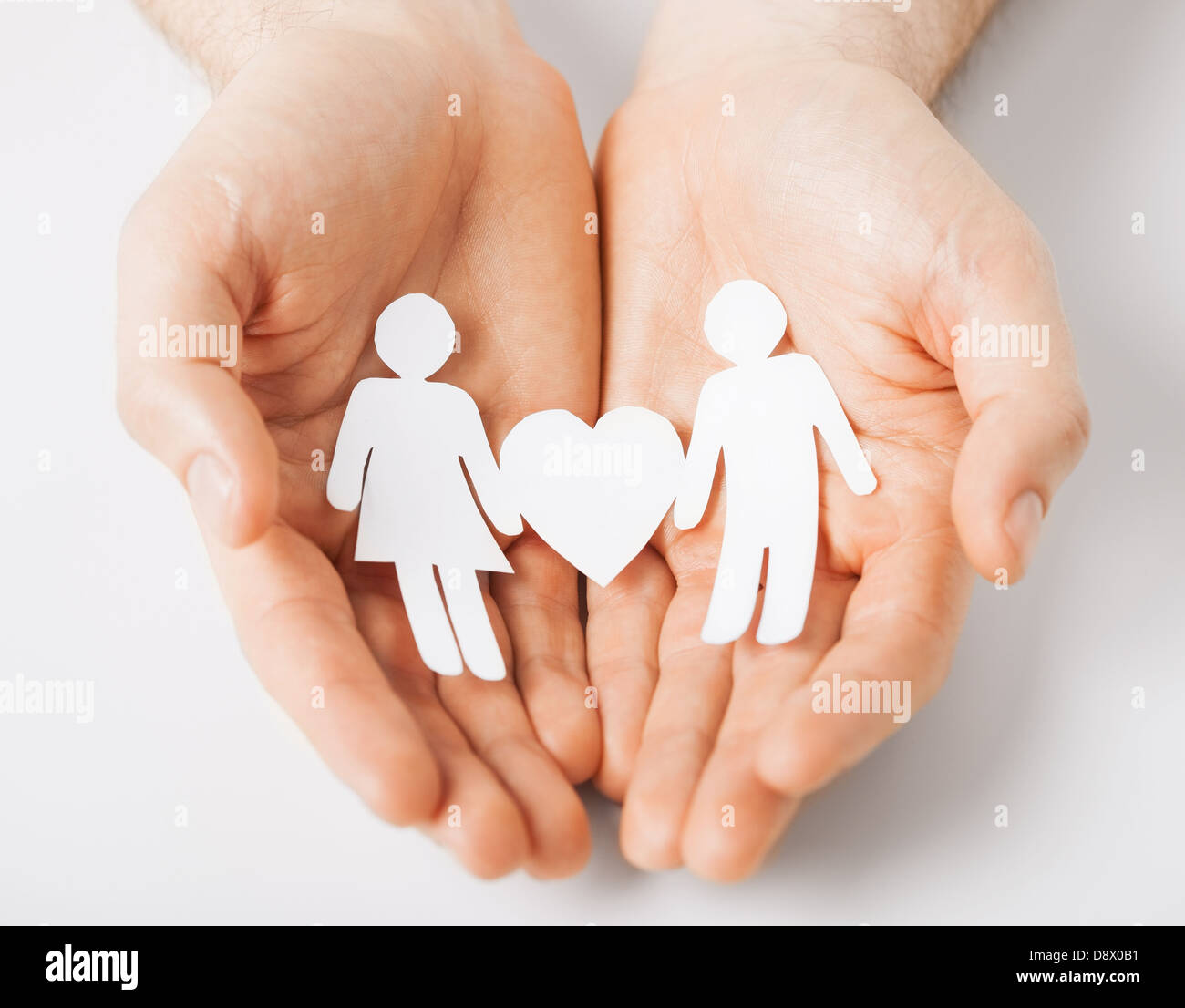 man hands with paper men Stock Photo - Alamy