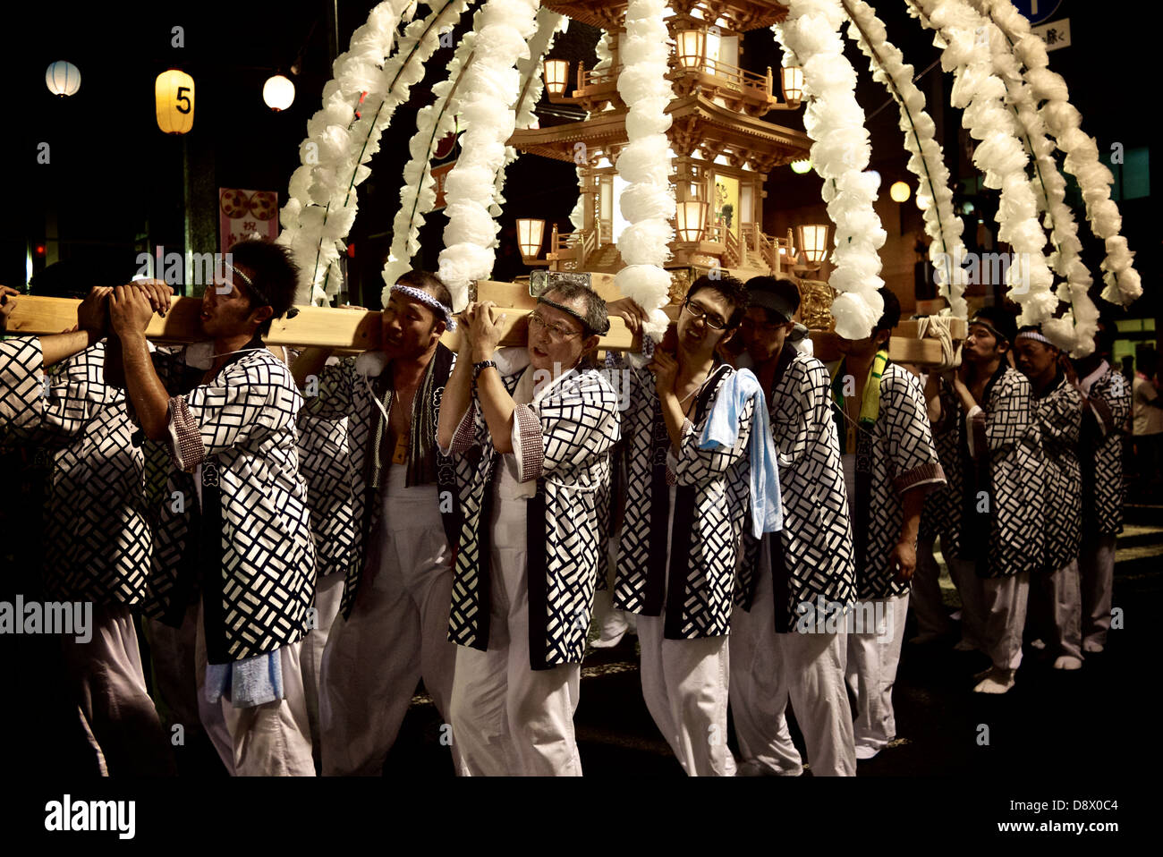 Group of Japanese Men Carrying on their Shoulders the Mikoshi (Portable ...