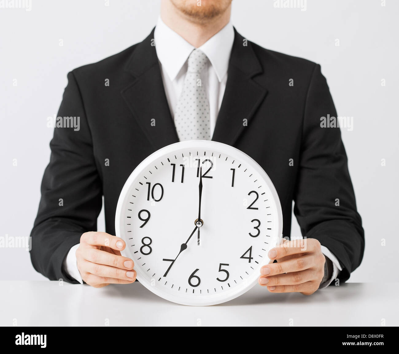man with wall clock Stock Photo - Alamy