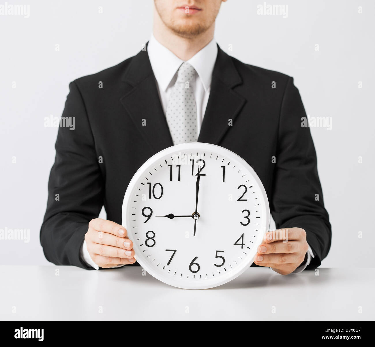 man with wall clock Stock Photo - Alamy