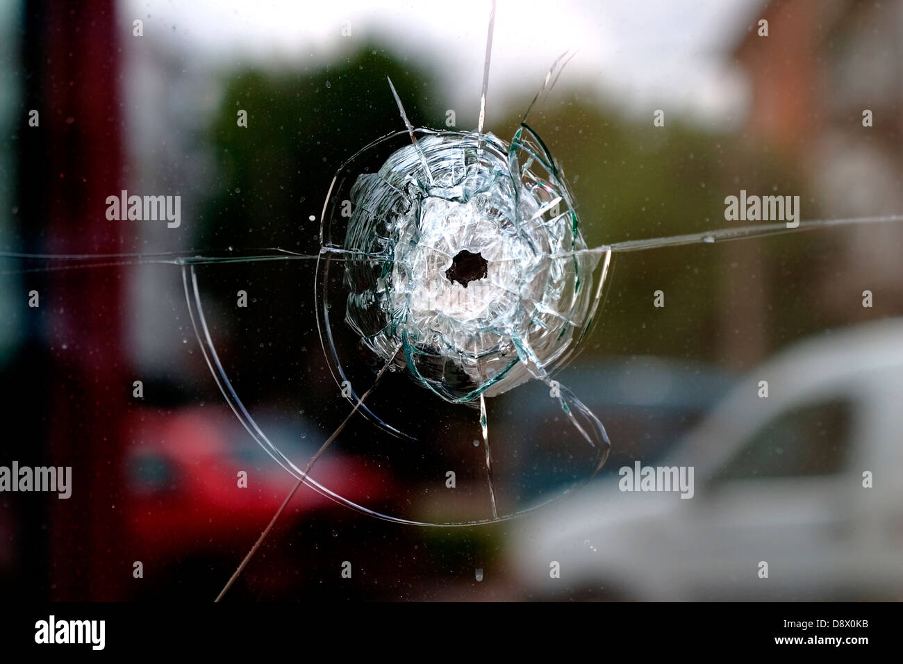 Glass window pierced by a shot Stock Photo - Alamy