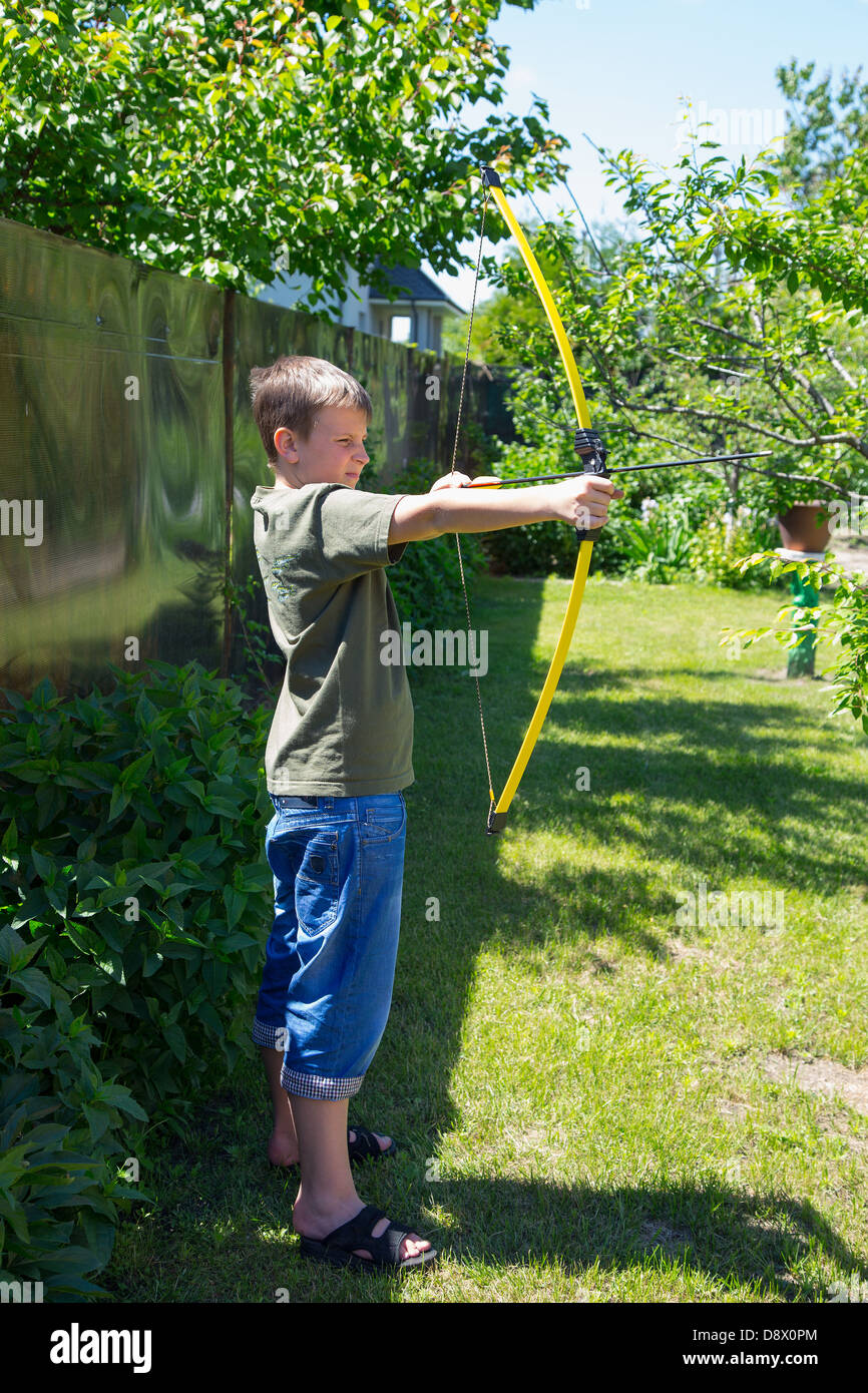 boy shooting a bow Stock Photo - Alamy