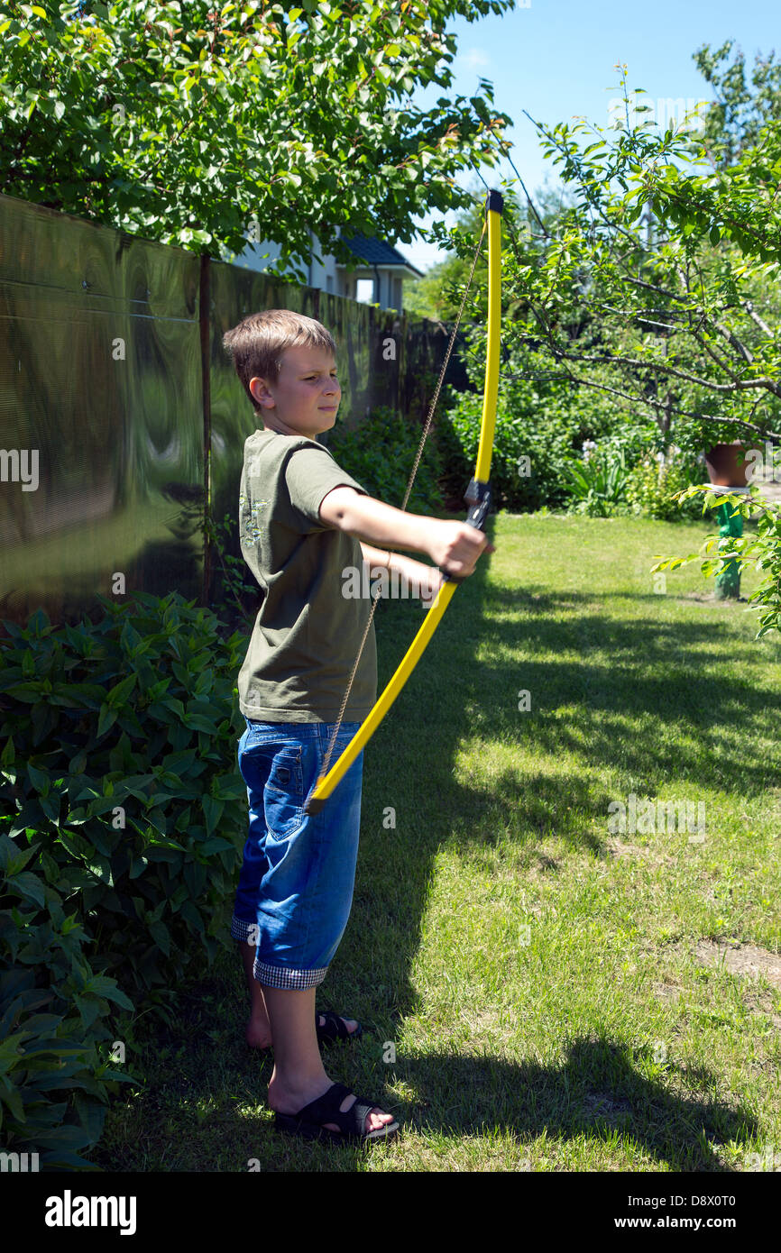 boy shooting a bow Stock Photo - Alamy