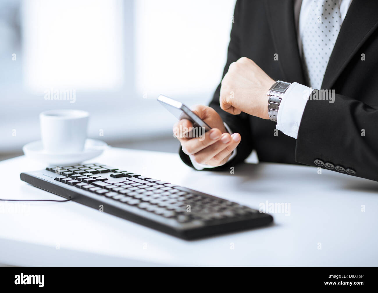 man hands with keyboard, smartphone and wristwatch Stock Photo - Alamy