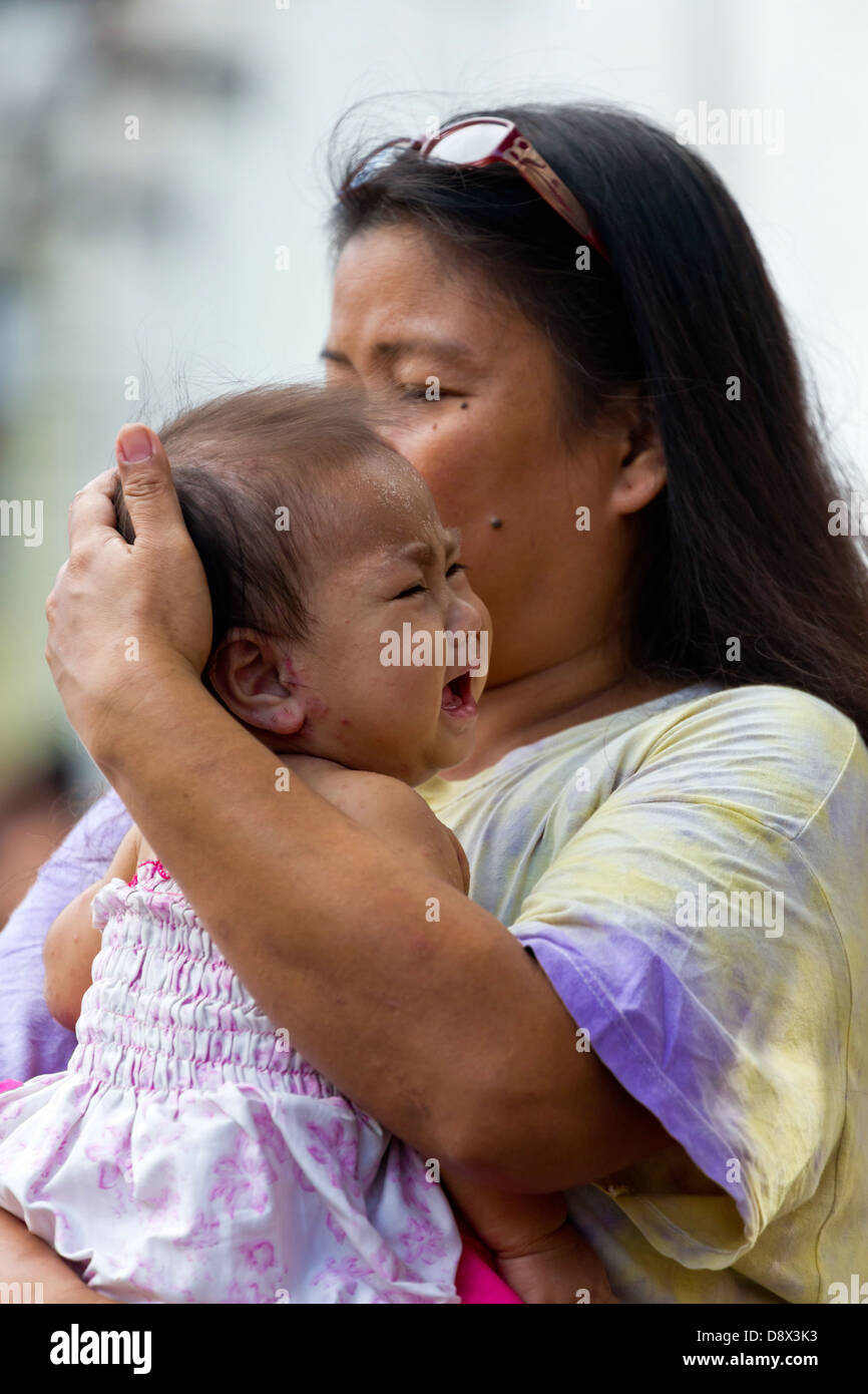 Crying Baby in the Streets of Manila, Philippines Stock Photo - Alamy