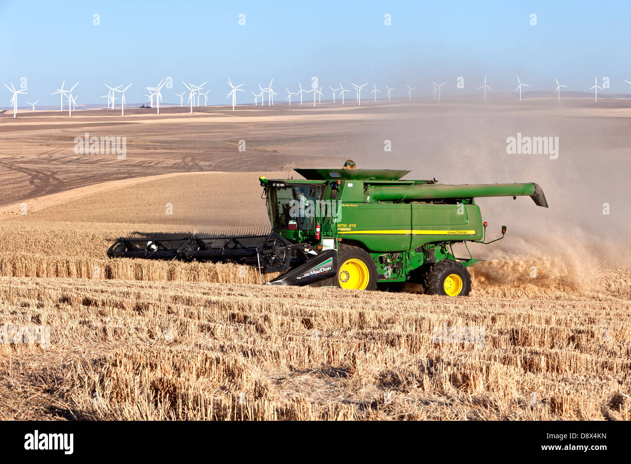 John deere combine harvester harvesting wheat hi-res stock photography ...