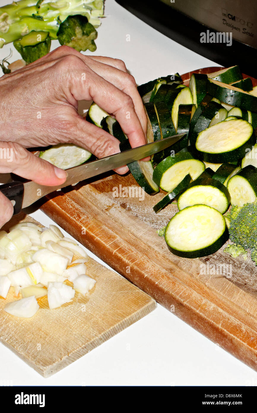 Vegetables being cut and prepared for cooking Stock Photo - Alamy
