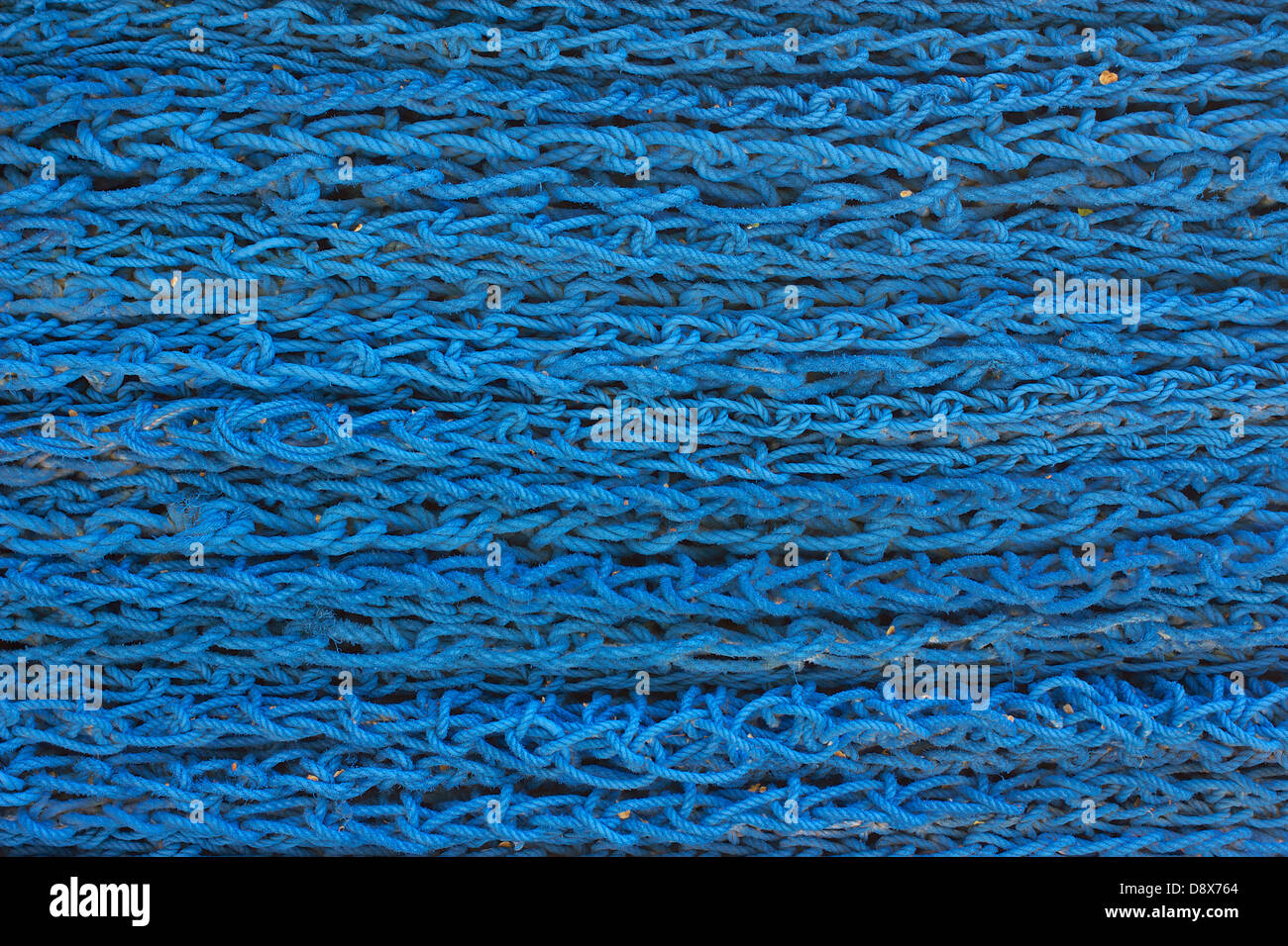 Tight stacks of blue rope forming a textured background Stock Photo - Alamy