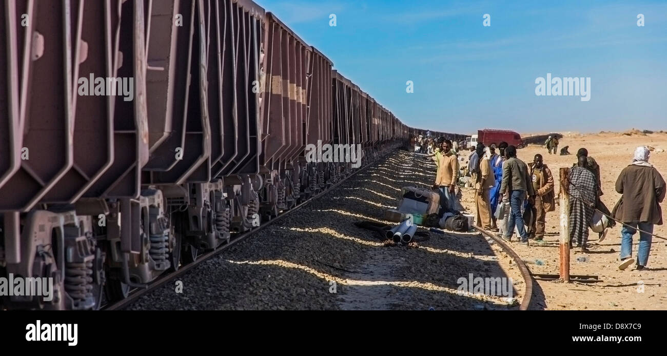 People wait to board the iron ore train in Nouadhibou, Mauritania Stock ...