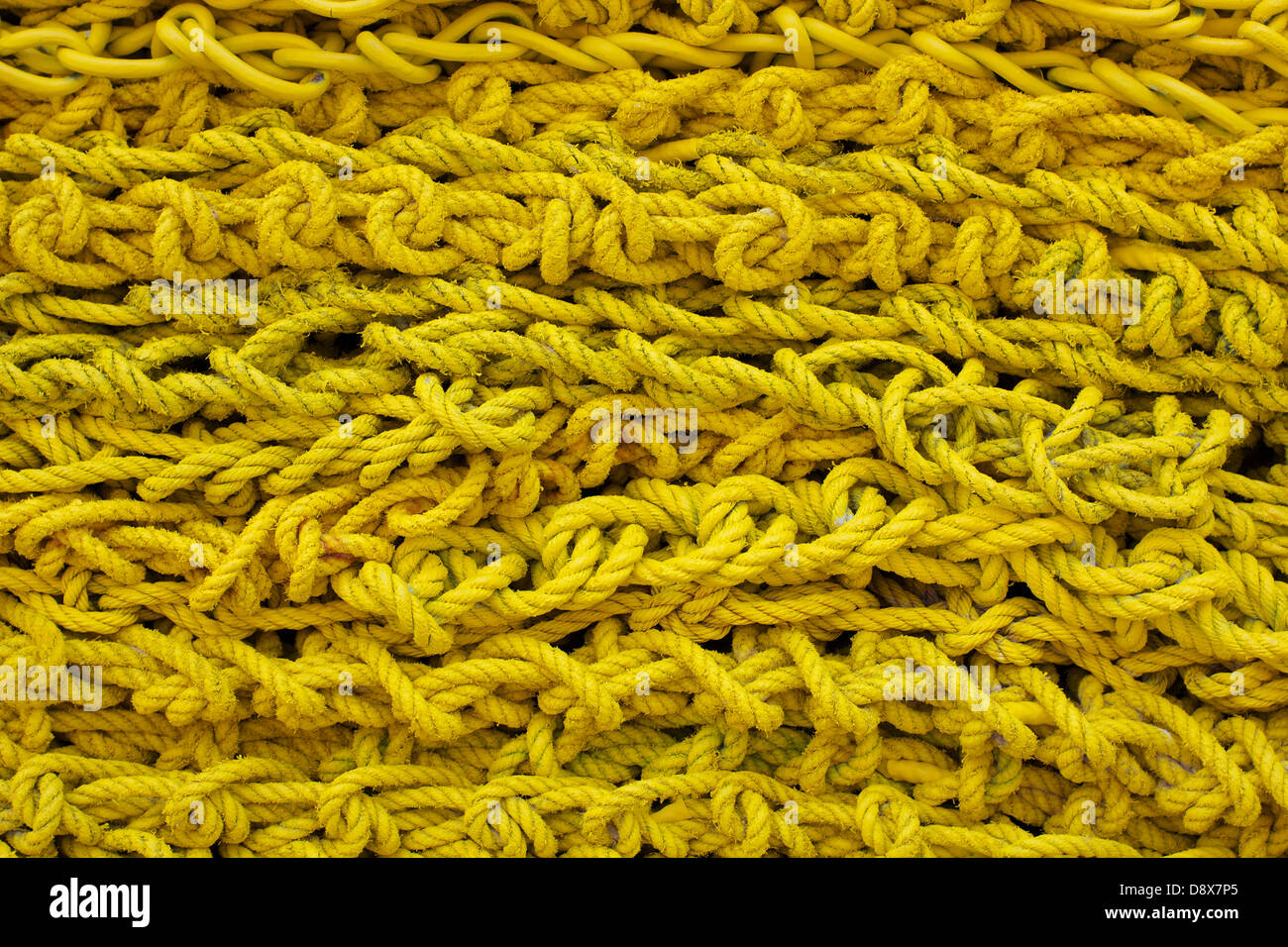 Tight stacks of yellow rope forming a textured background Stock Photo ...