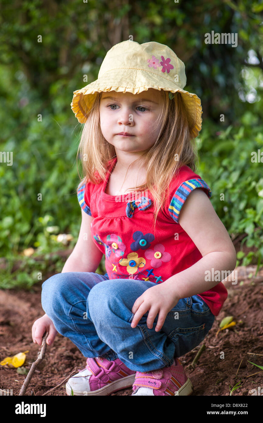 2 year old girl playing outside Stock Photo - Alamy