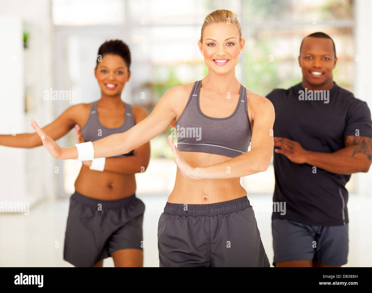 cute sporty group exercising Stock Photo - Alamy