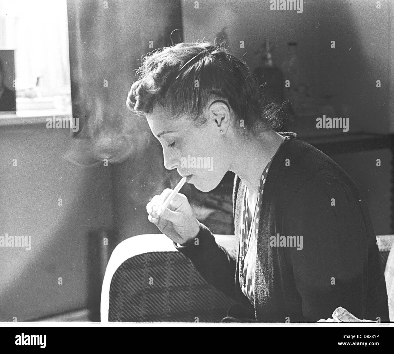 Woman smoking cigarette historical hi-res stock photography and images ...