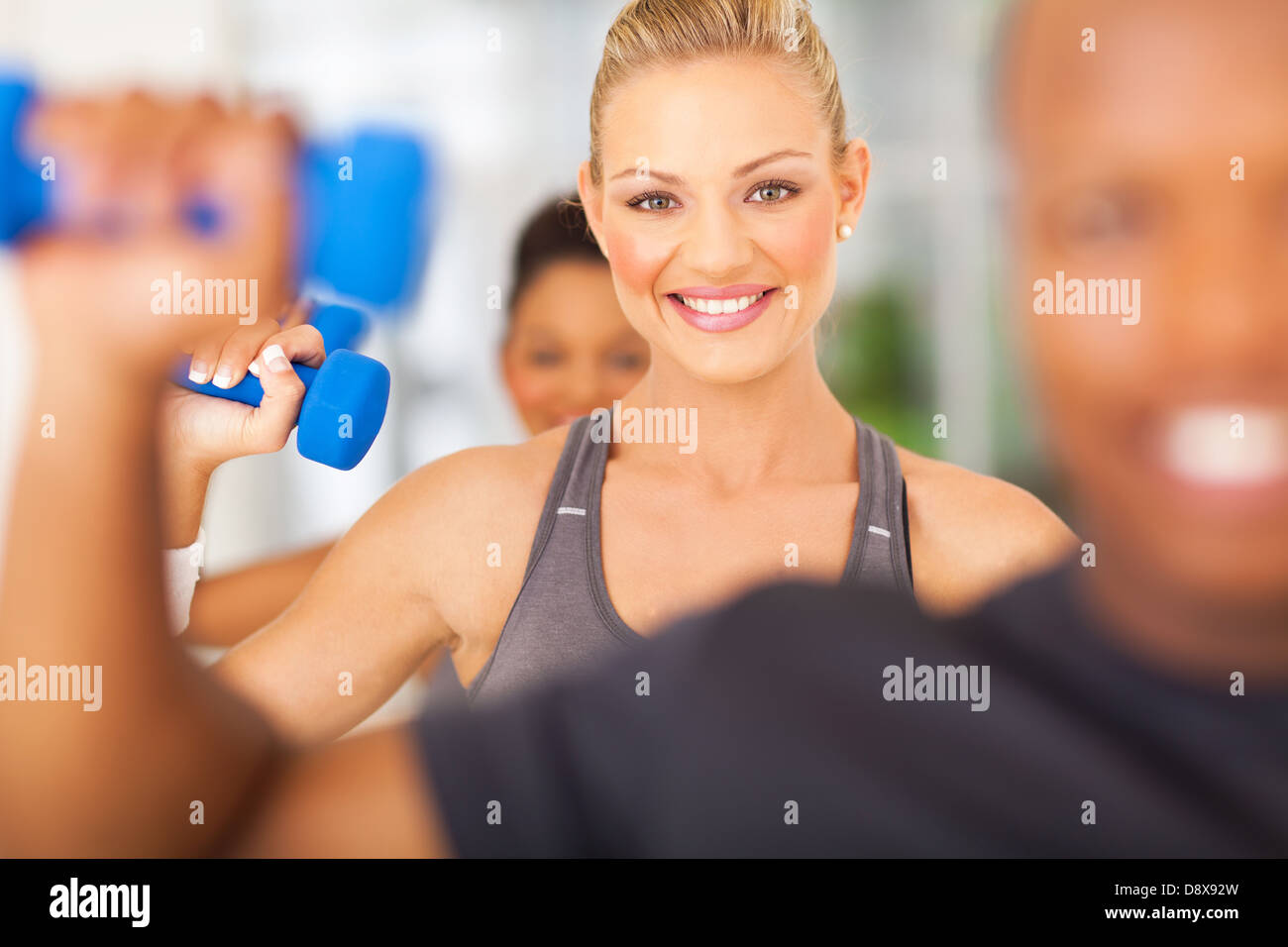 happy woman exercise in gym with dumbbells Stock Photo - Alamy