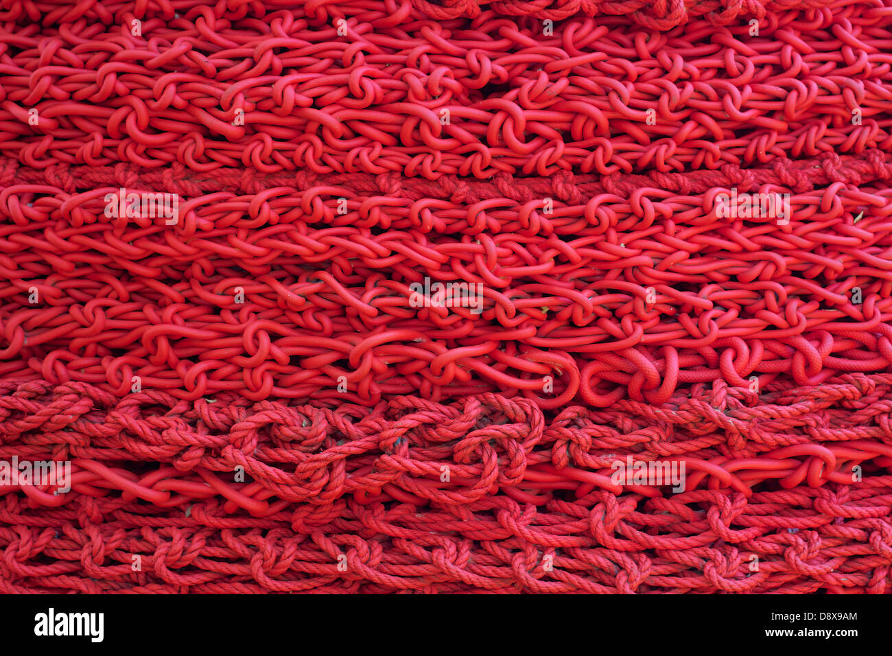 Tight stacks of red rope forming a textured background Stock Photo - Alamy
